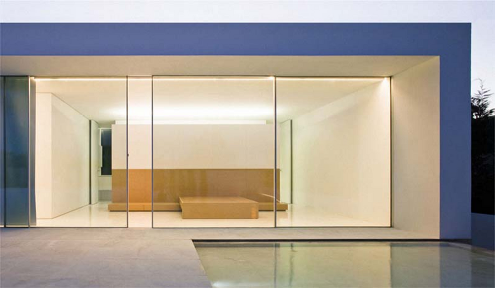 Frameless windows create an uninterrupted flow from interior to exterior.